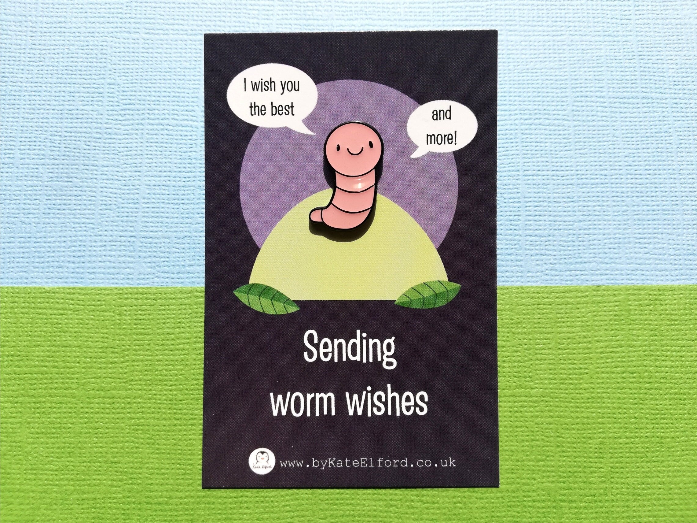 Sending worm wishes enamel pin – by Kate Elford